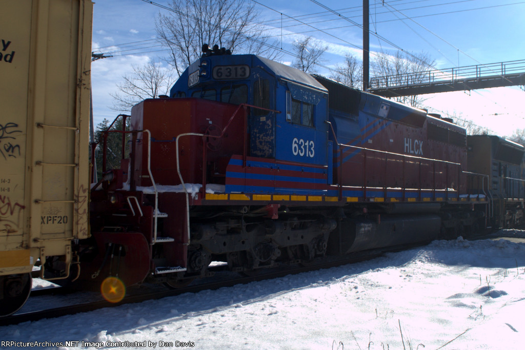 HLCX SD40-2 6313 trails on Q409-05